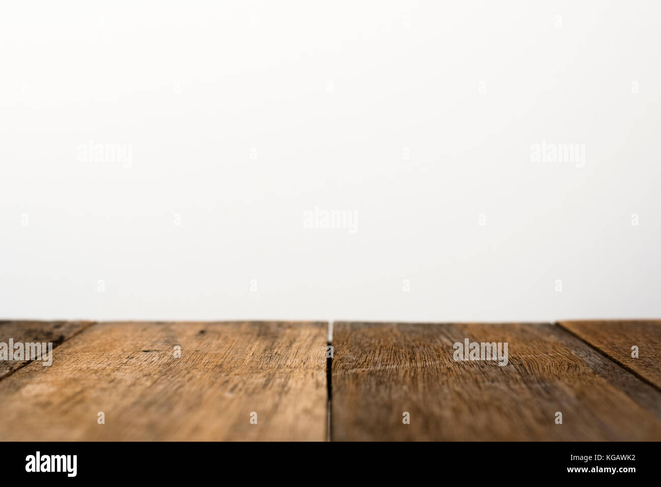 empty wooden table top isolated on white background, used for display ...