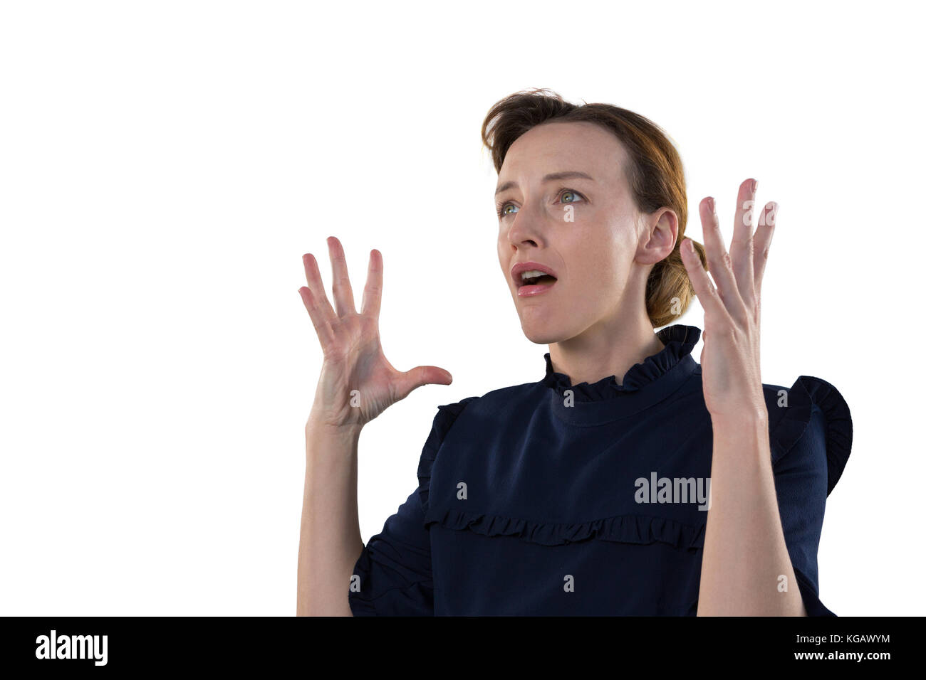Frustrated female executive standing against white background Stock ...