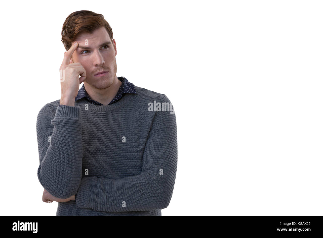 Confused male executive standing against white background Stock Photo ...