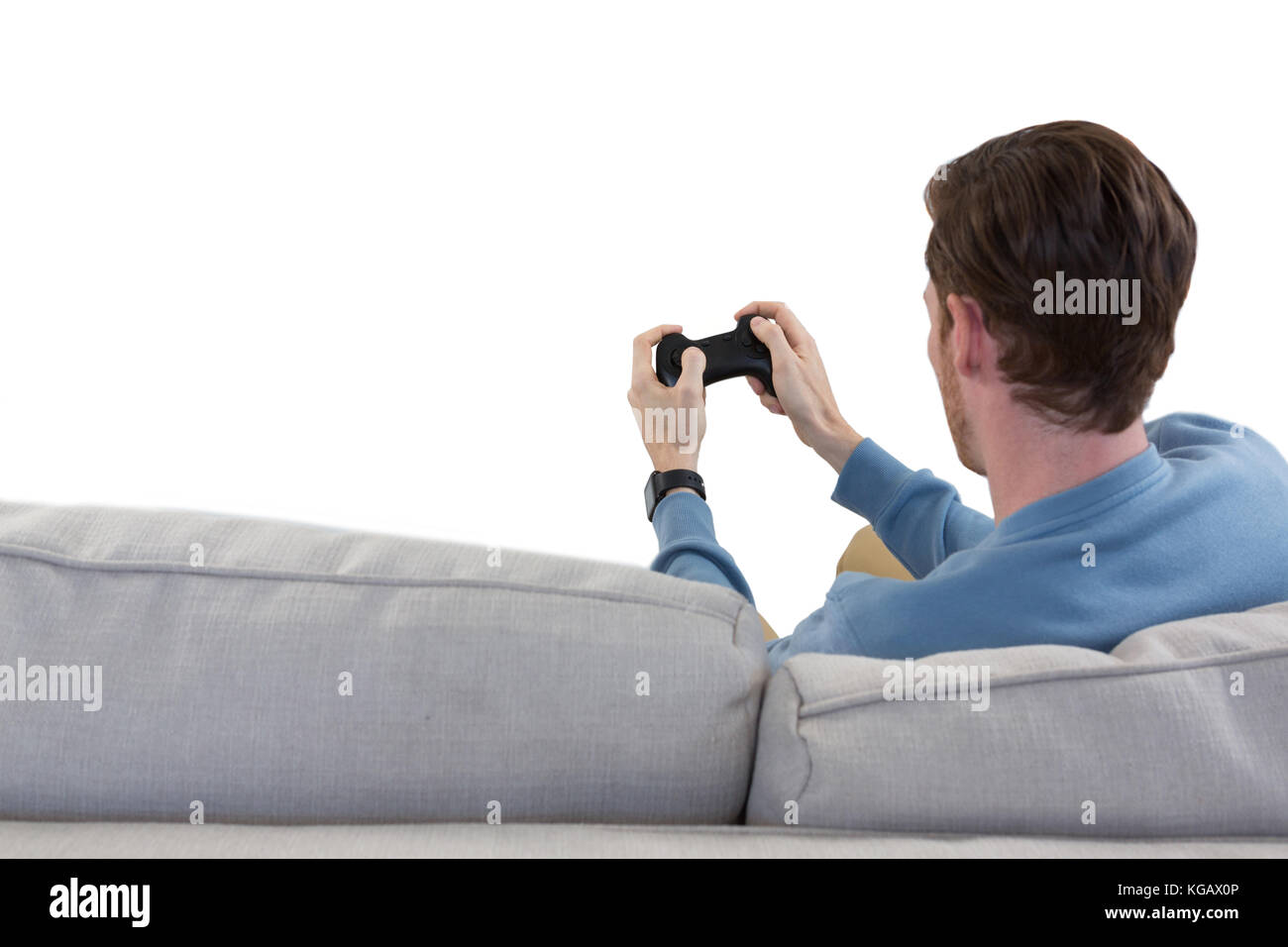 Rear view of man playing video game against white background Stock ...