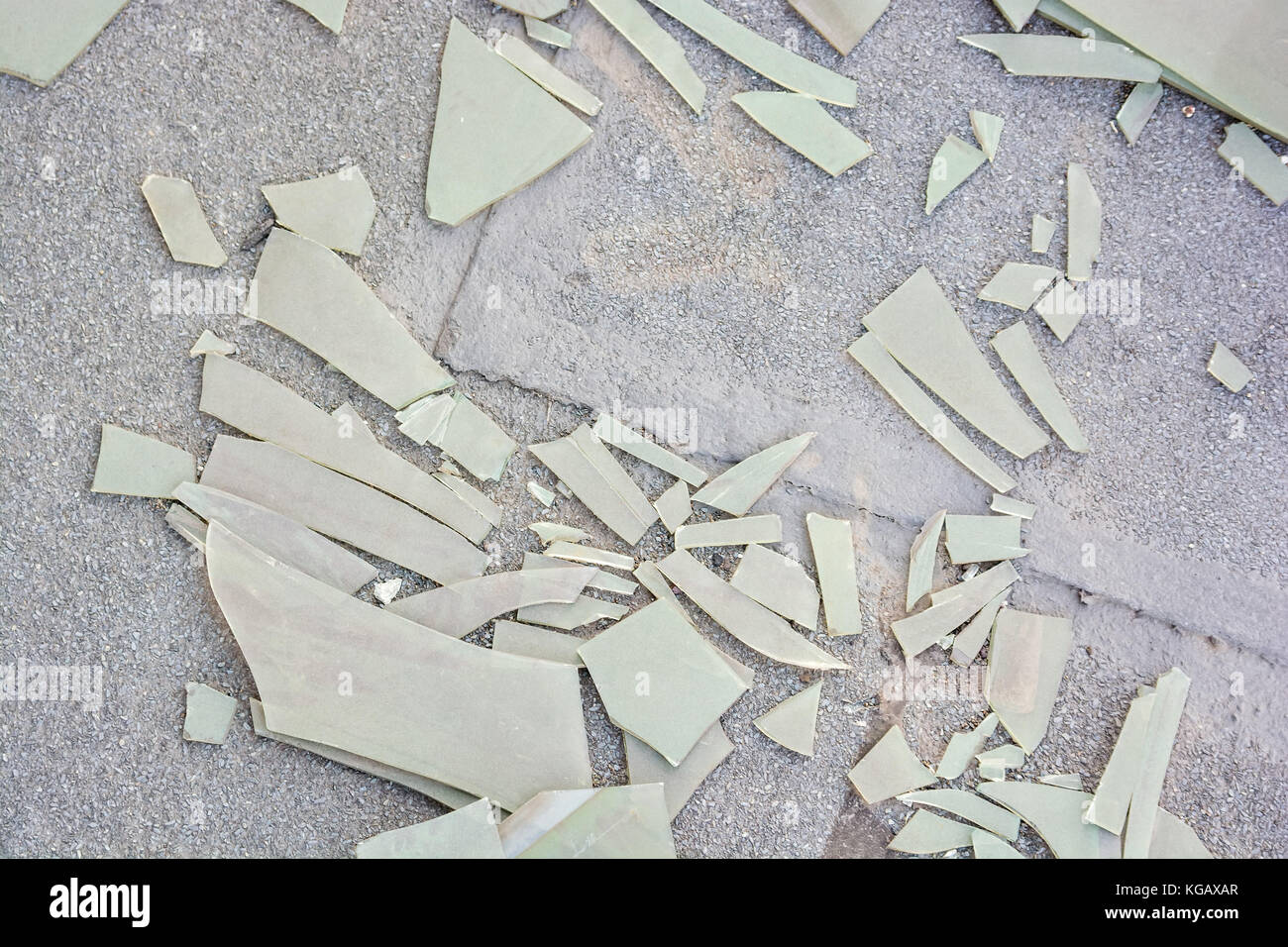 Close up shattered light green plastic sheet on ground Stock Photo - Alamy