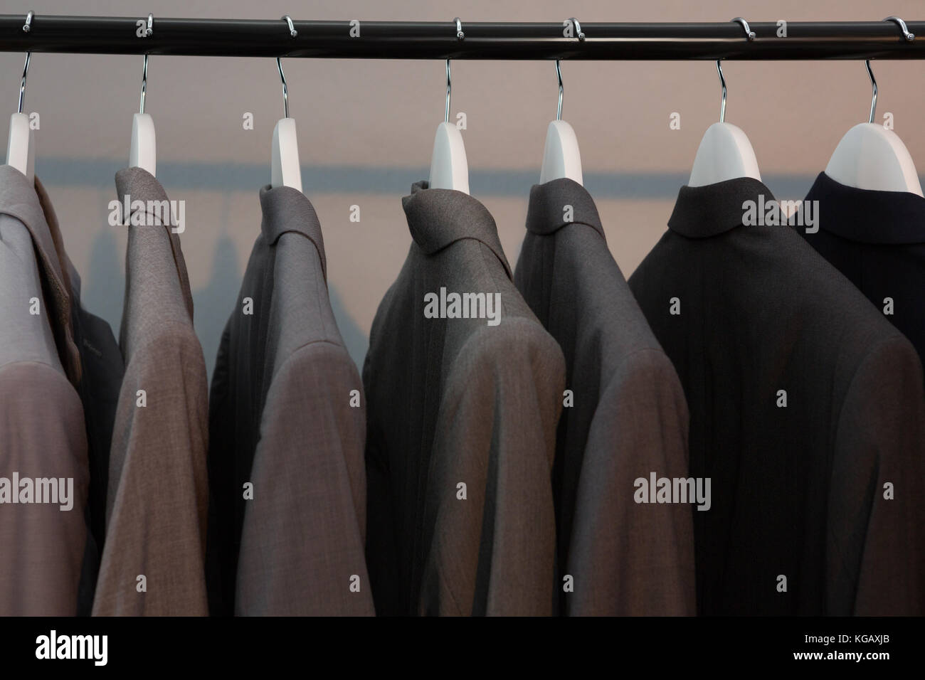 Close-up of blazers hanging on cloth hanger Stock Photo - Alamy
