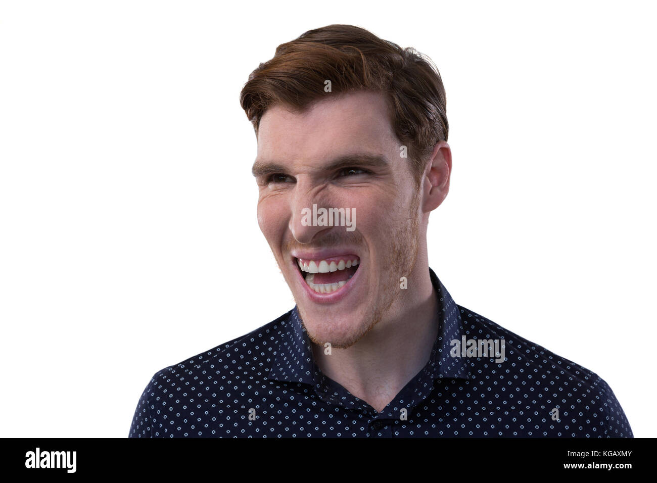 Frustrated male executive standing against white background Stock Photo ...