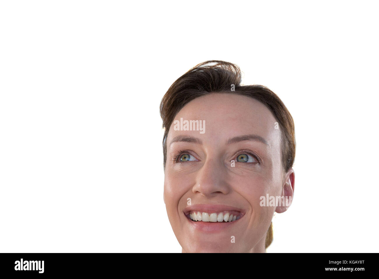 Thoughtful woman smiling against white background Stock Photo - Alamy