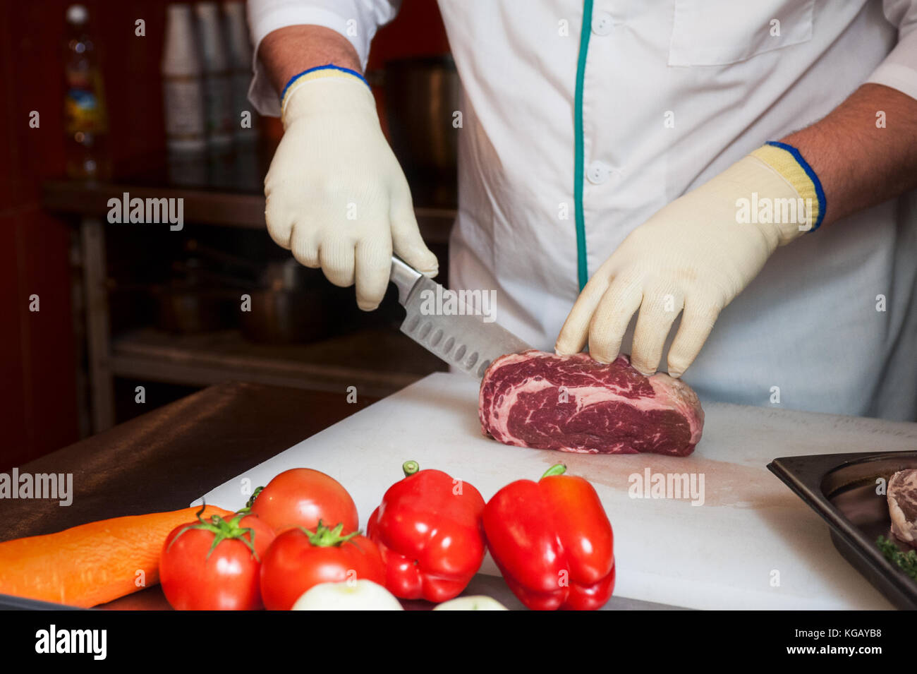 Chef cutting meat Stock Photo - Alamy