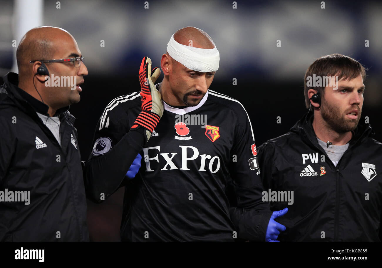 Watford goalkeeper Heurelho Gomes receives treatment after suffering a ...