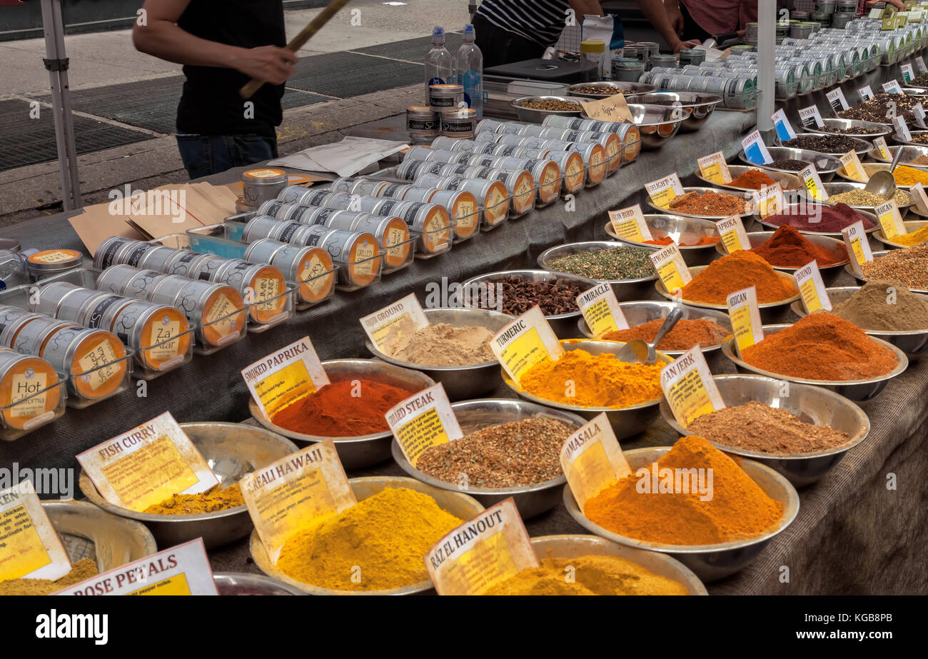 Colorful spices on display for sale in an open market in New York City ...