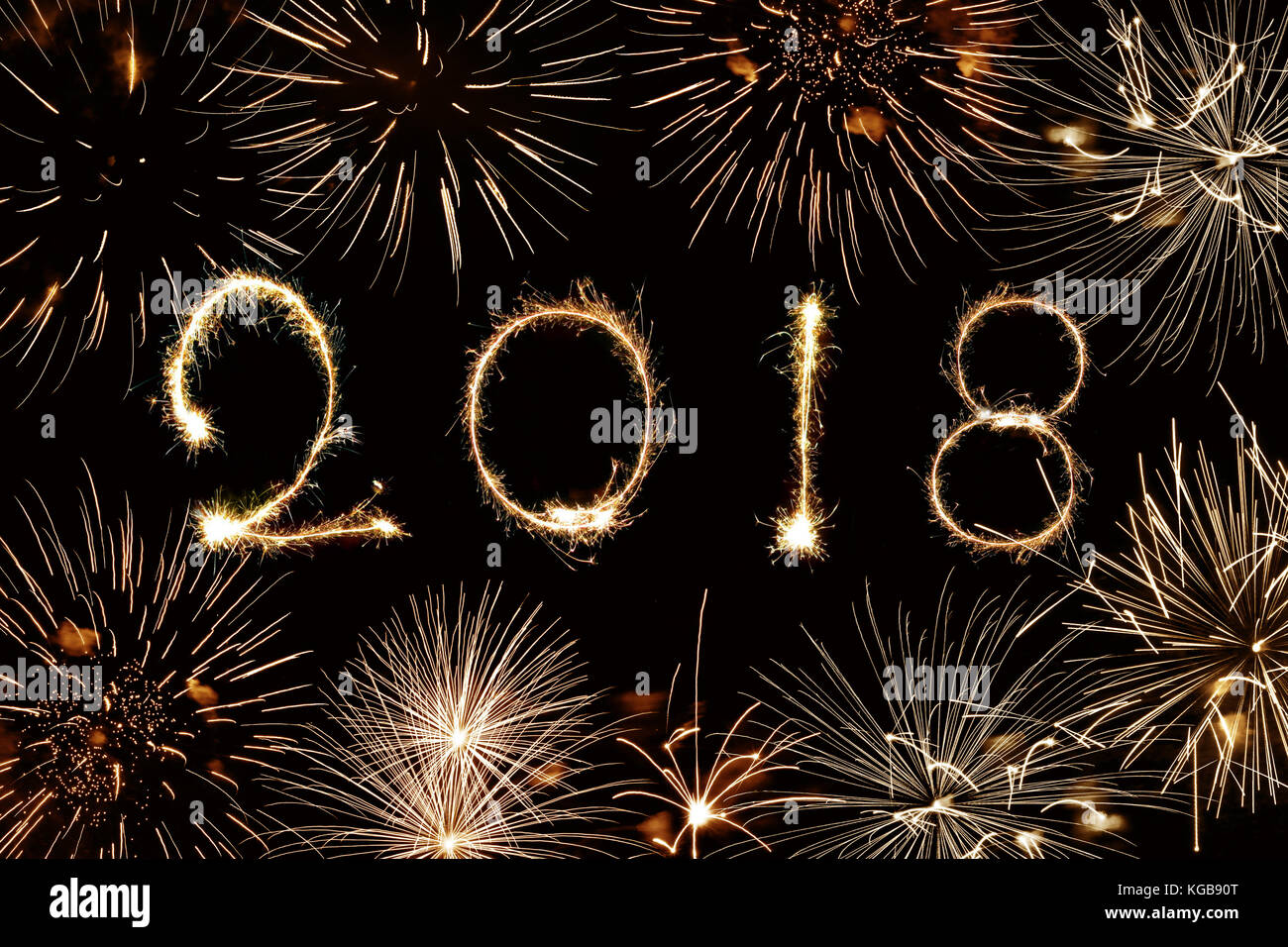 2018 written with sparkles and fireworks Stock Photo - Alamy