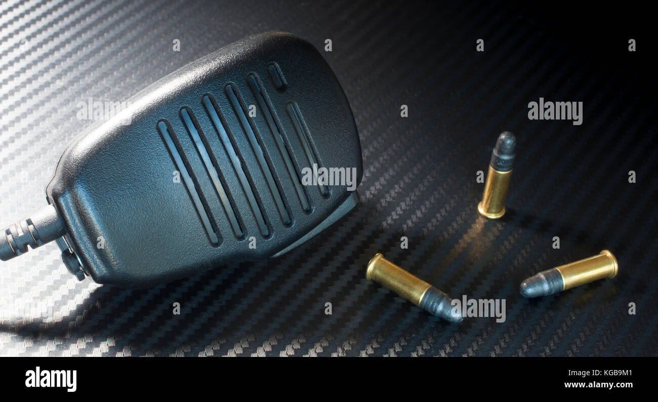 Police style microphone on a dark background with bullets Stock Photo ...
