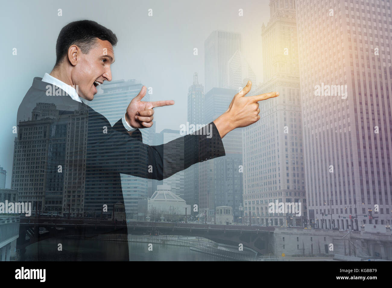 Happy delighted man pointing with his hands Stock Photo - Alamy