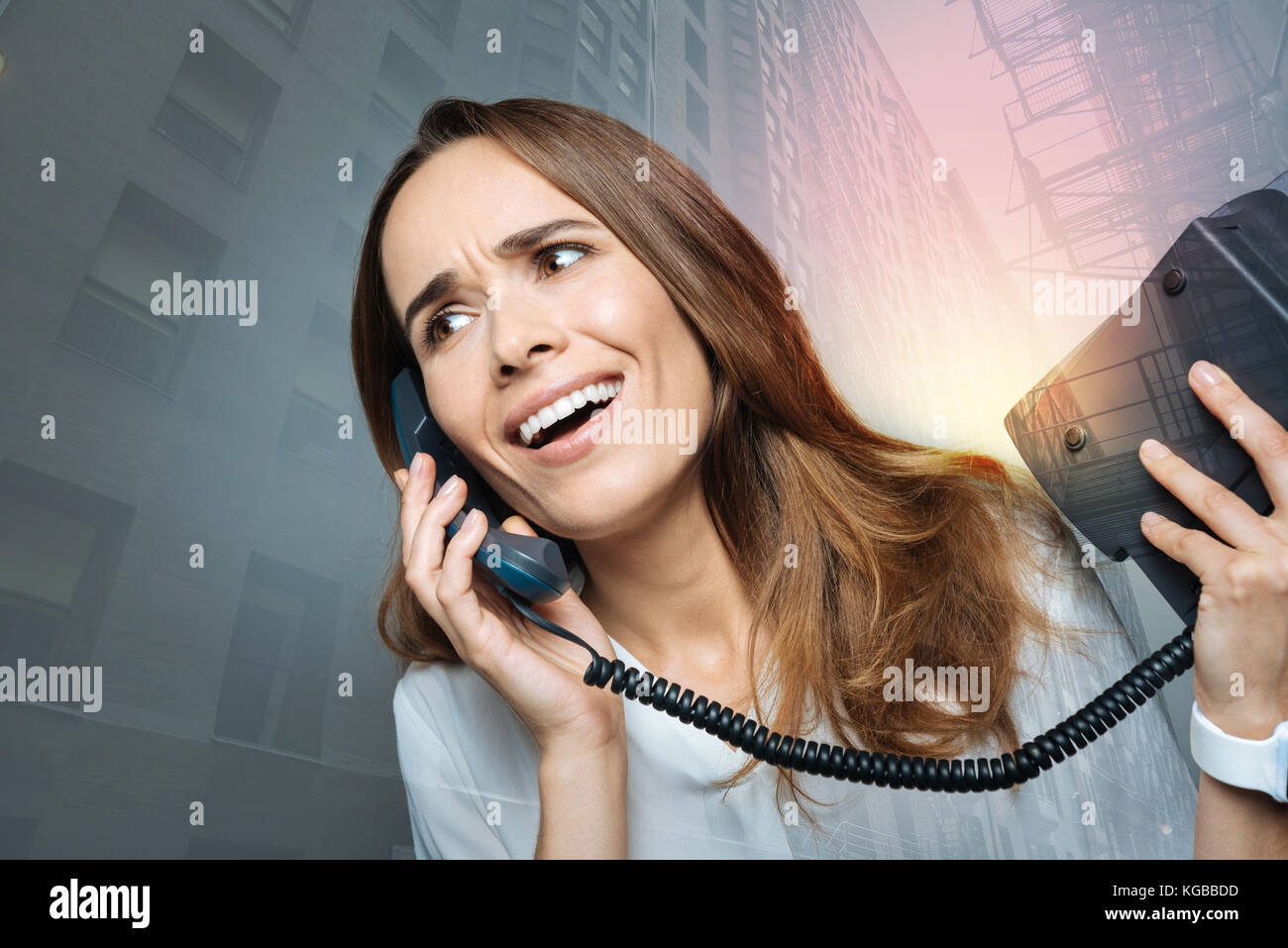 Positive emotional woman talking on the phone Stock Photo - Alamy