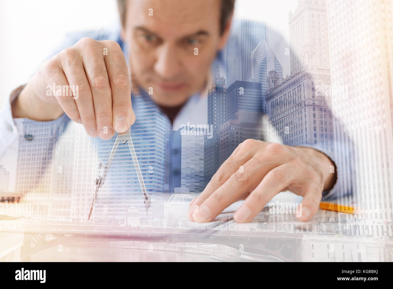 Professional engineer drawing with compasses Stock Photo - Alamy