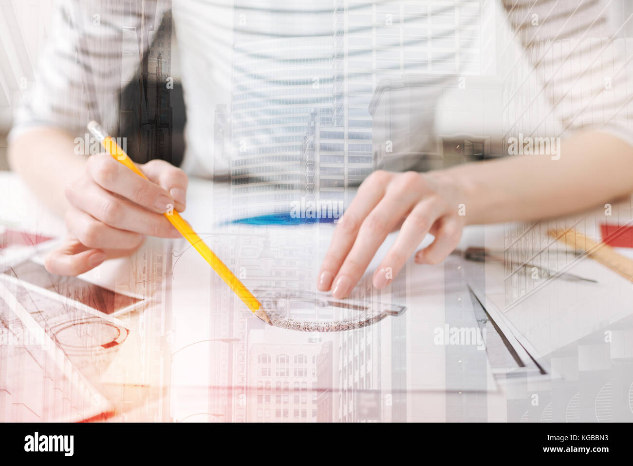 Professional female engineer drawing a blueprint Stock Photo - Alamy