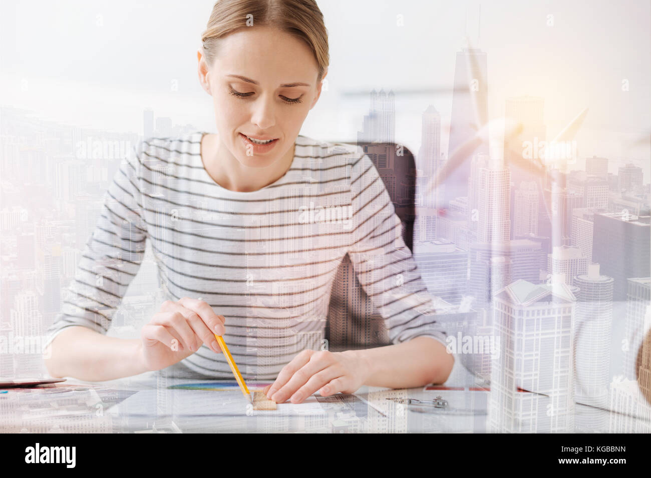Concentrated female eco engineer Stock Photo - Alamy