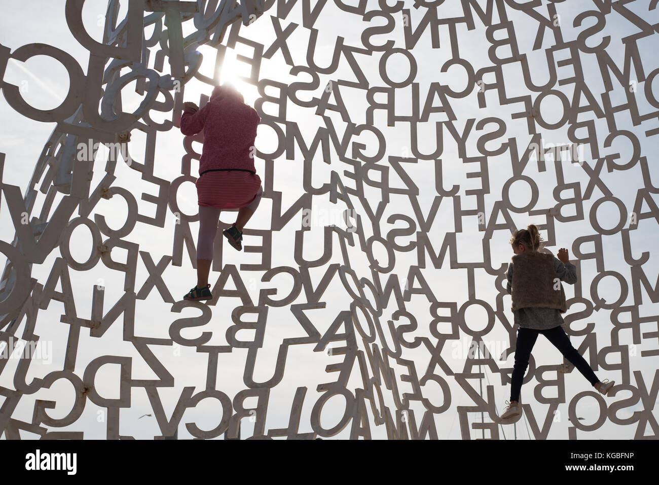 Children can be seen climbing up the sculpture "Nomade" by the artist ...