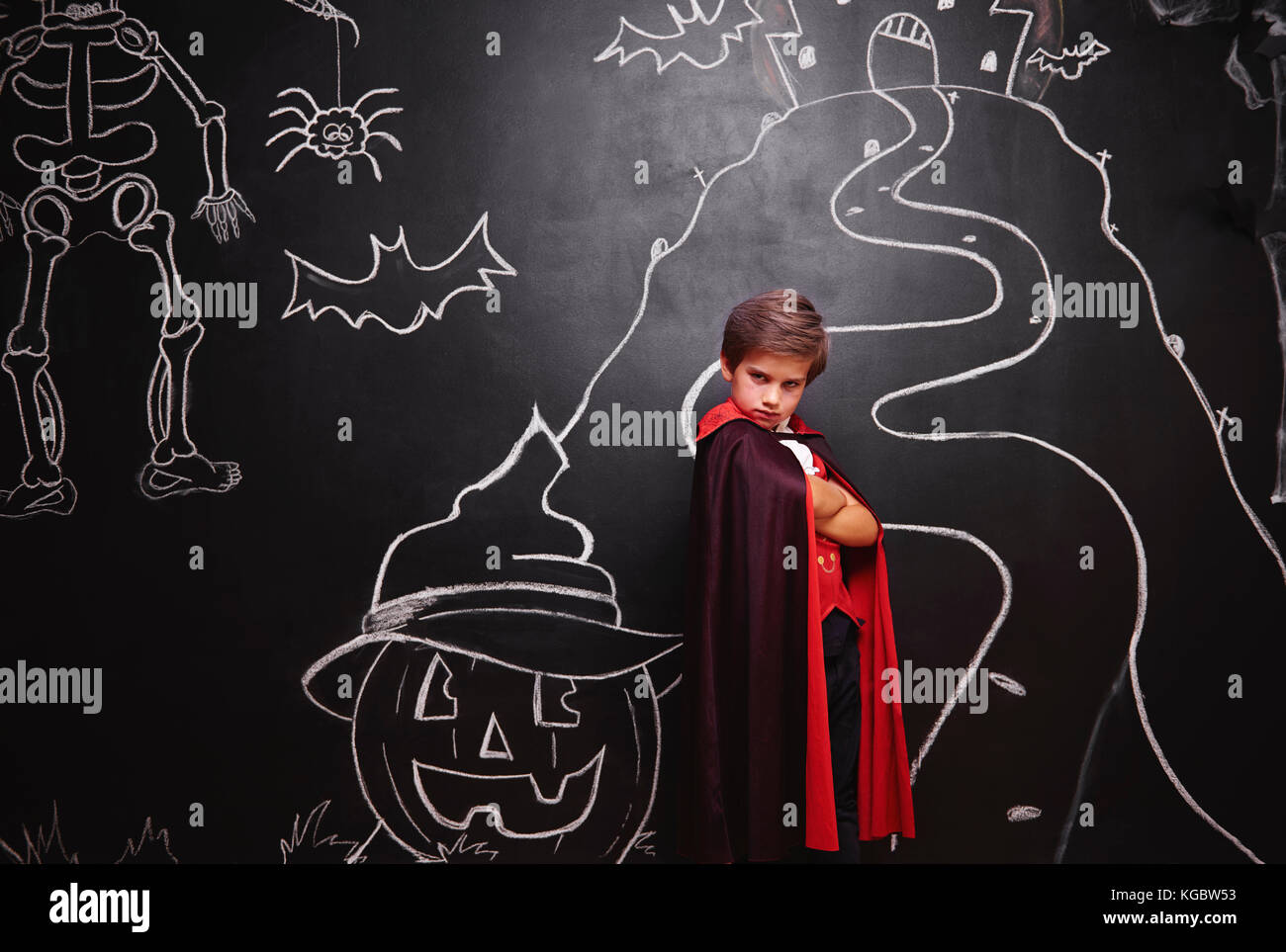 Boy in vampire costume posing Stock Photo - Alamy