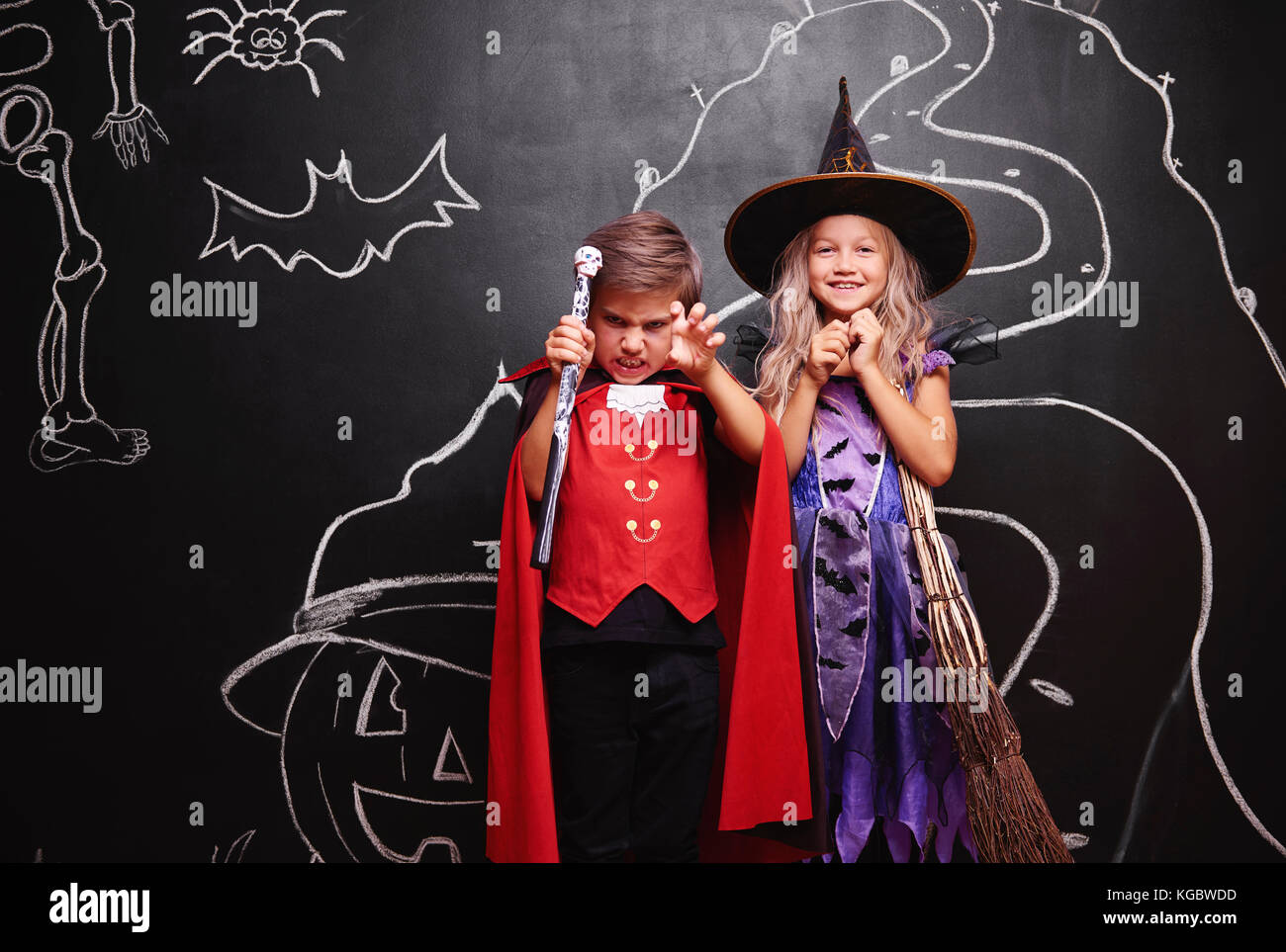 Couple wearing in costume witch and vampire Stock Photo - Alamy