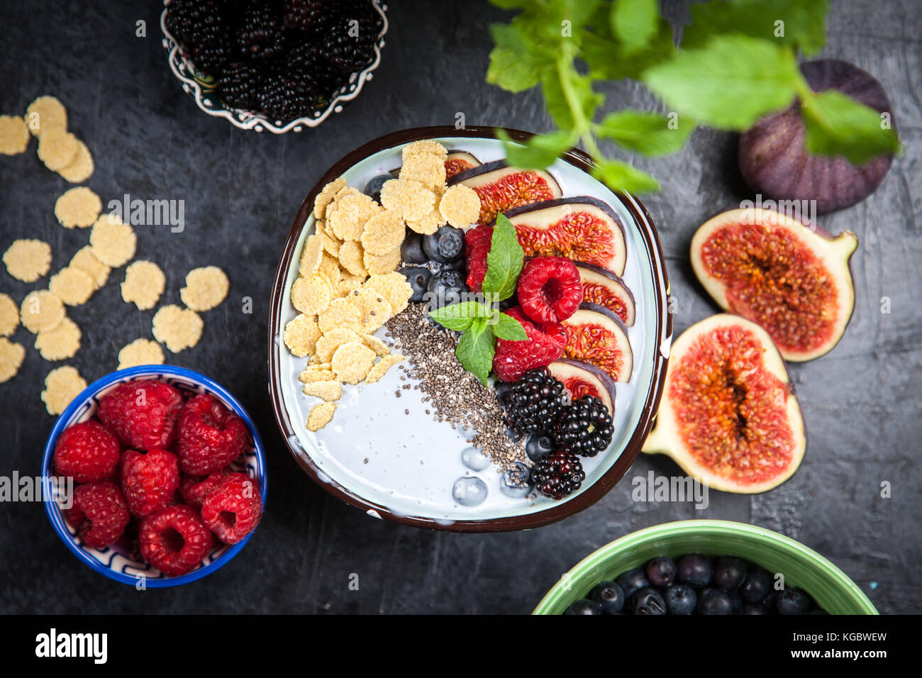 Delicious yoghurt bowl with blueberries, raspberry, figs and chia seeds ...