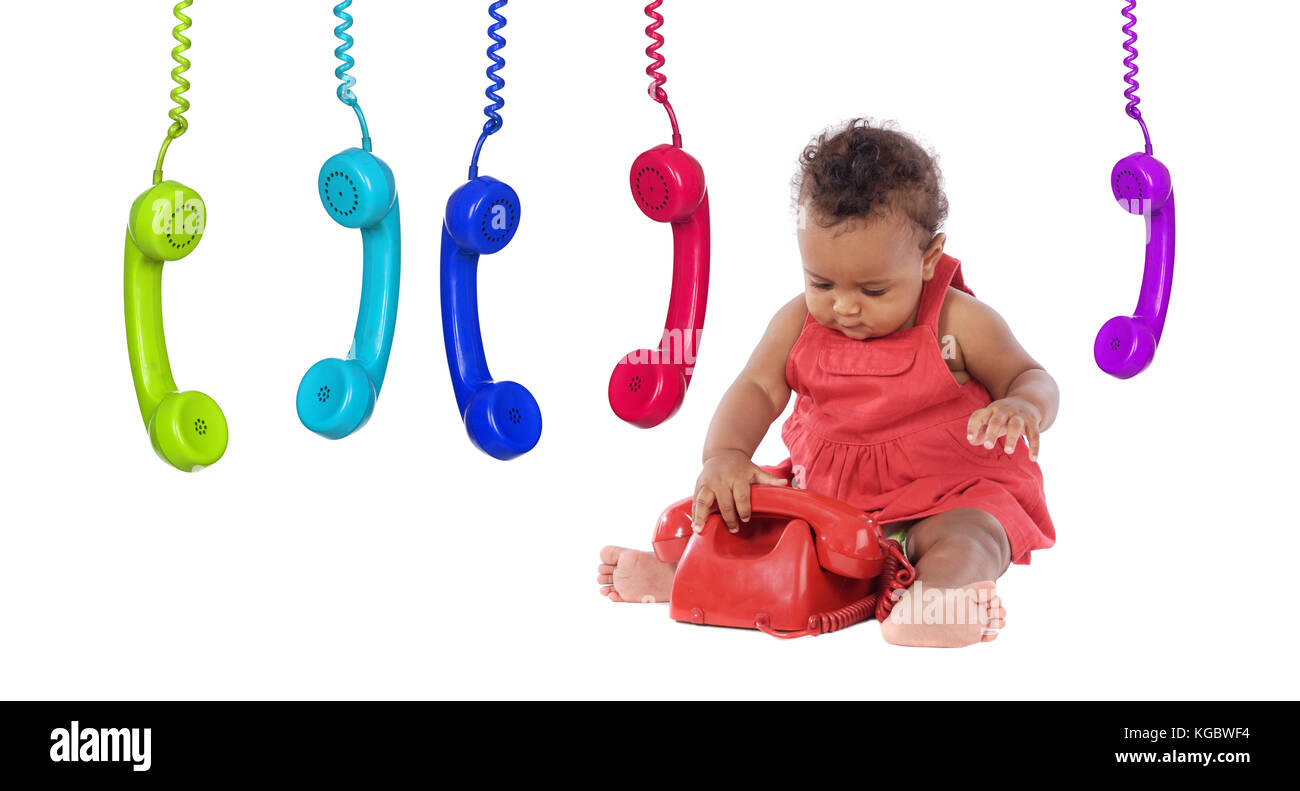 Adorable african baby in red with a vintage phone and many color phones ...