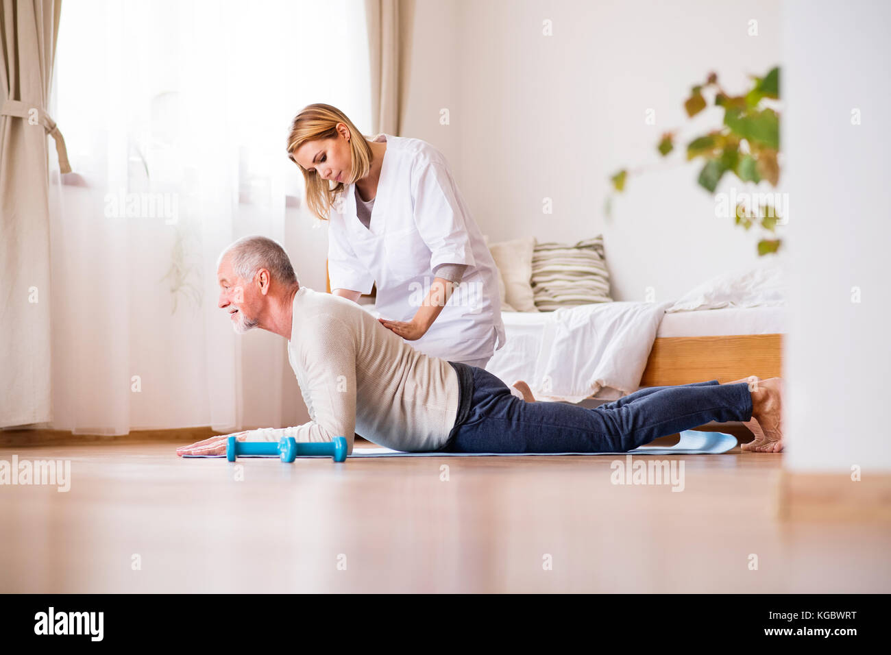 Health visitor and senior man during home visit Stock Photo - Alamy
