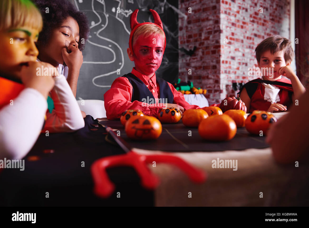 Children in the devil costume hi-res stock photography and images - Alamy