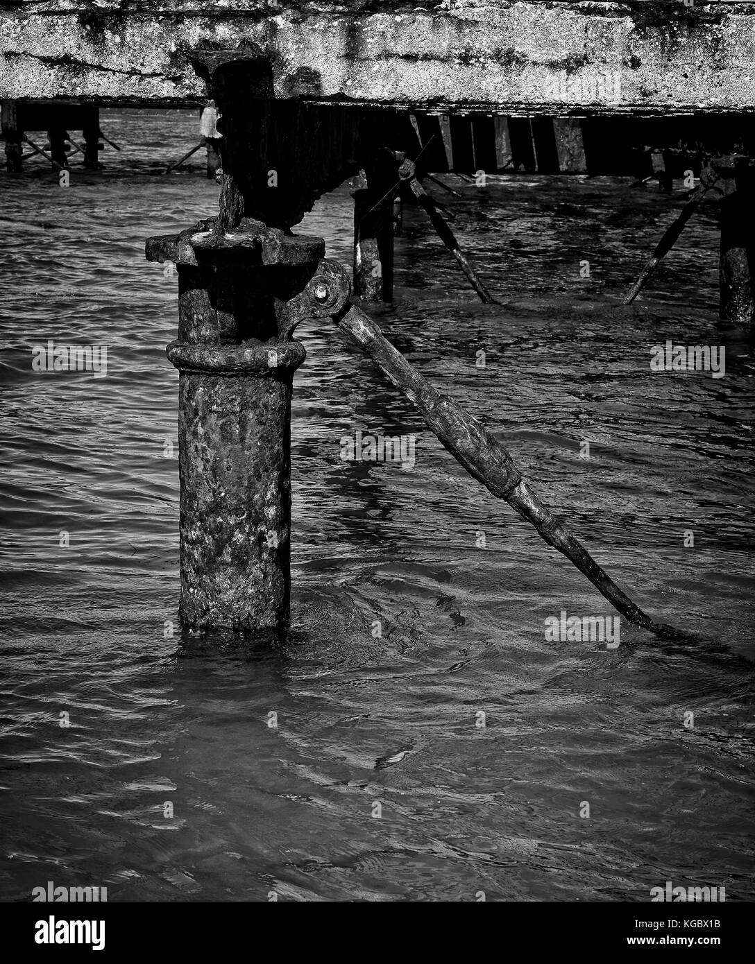 the rotting remains of a Victorian pier separated from the land to ...