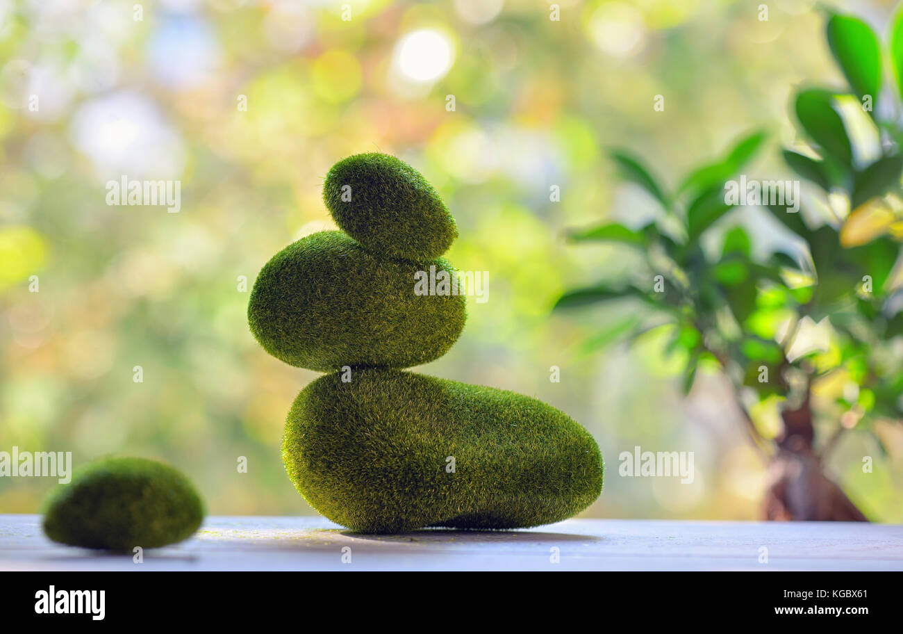 Pyramid from pebbles covered with grass Stock Photo - Alamy
