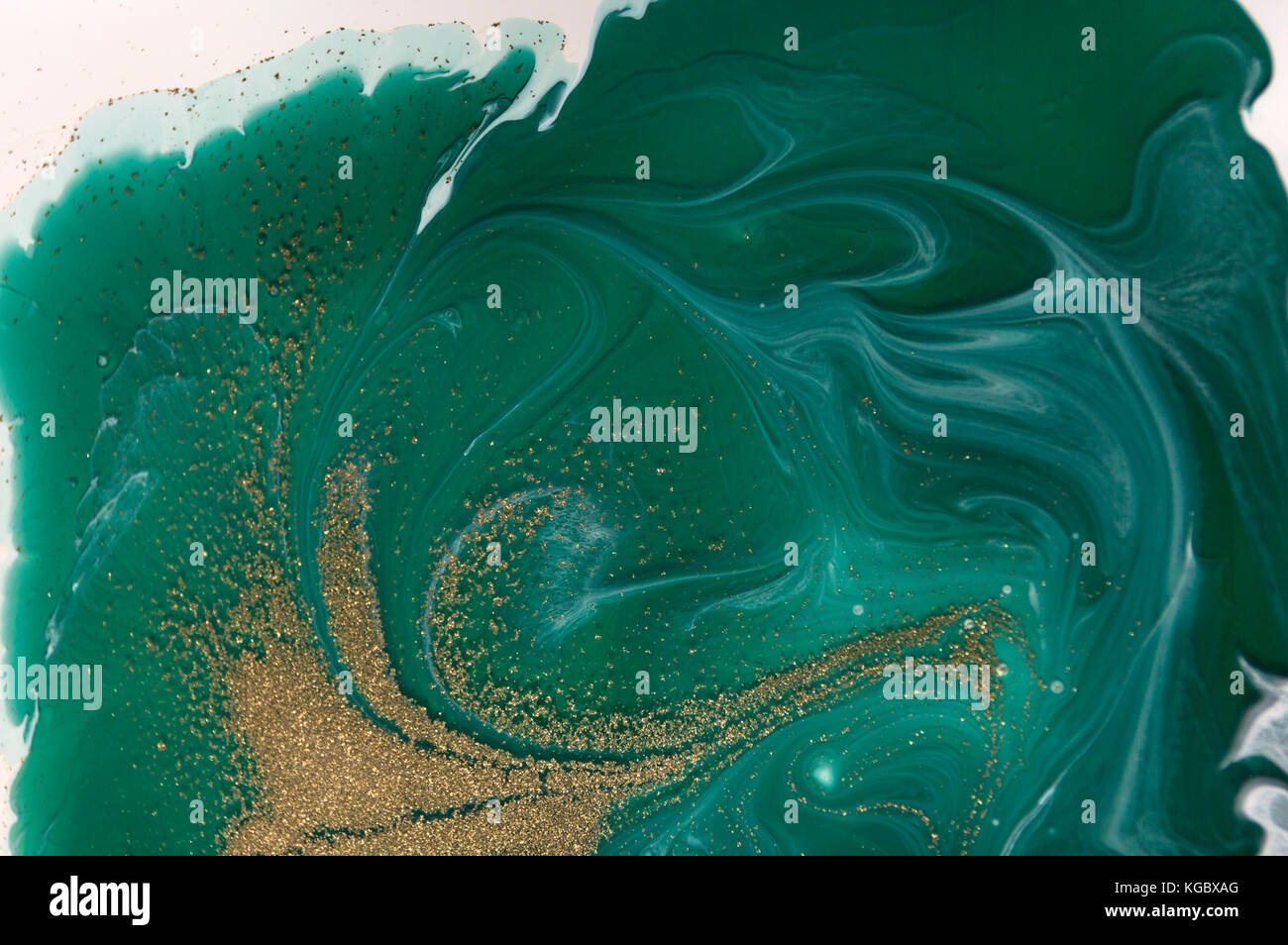 Marbled green abstract background with golden sequins. Liquid marble ...