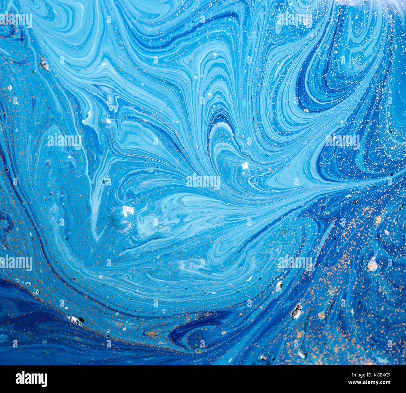 Marbled blue abstract background with golden sequins. Liquid marble ink ...