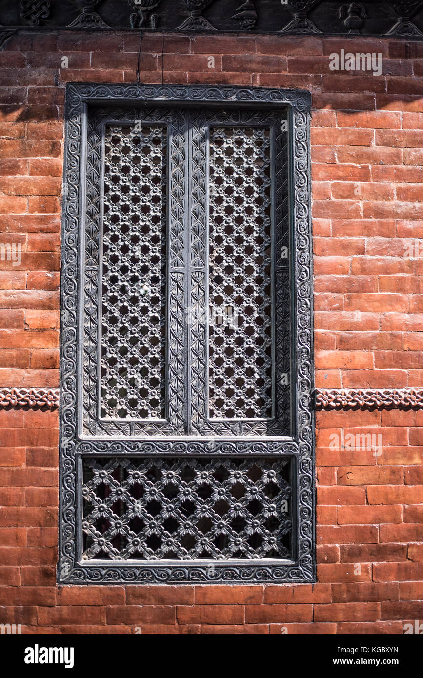 wooden traditional handcrafted window in the brick wallcarved Stock ...