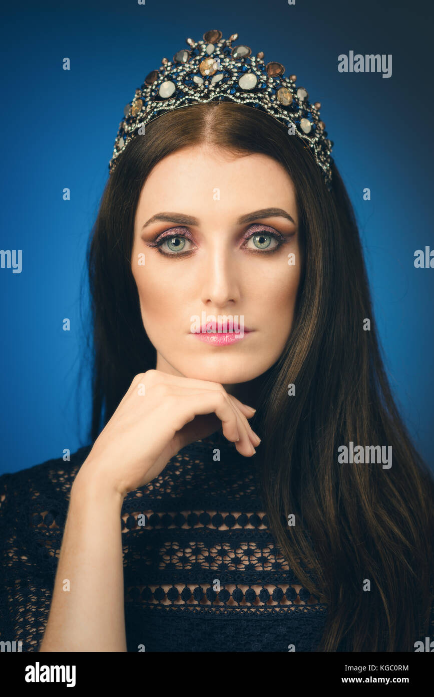 Woman looking regal, facing camera wearing a jewelled crown Stock Photo ...