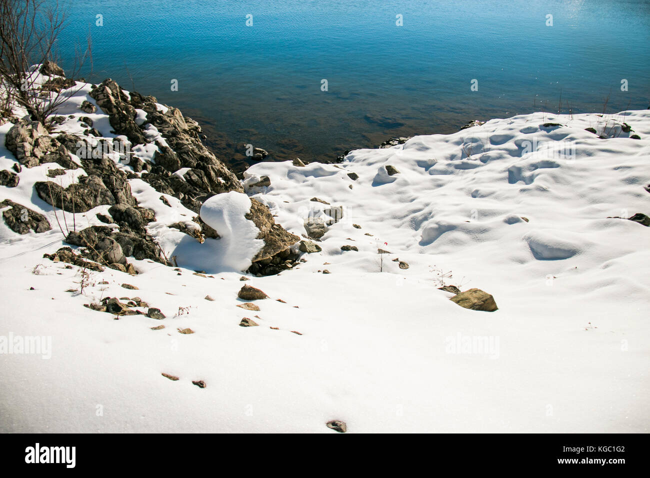 Winter detail. Snow and water Stock Photo - Alamy