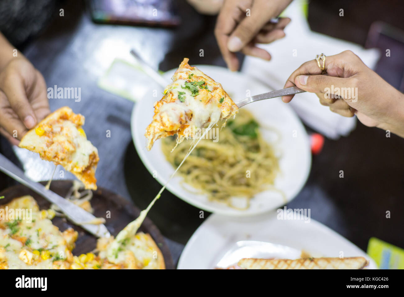 Sharing table restaurant hi-res stock photography and images - Alamy