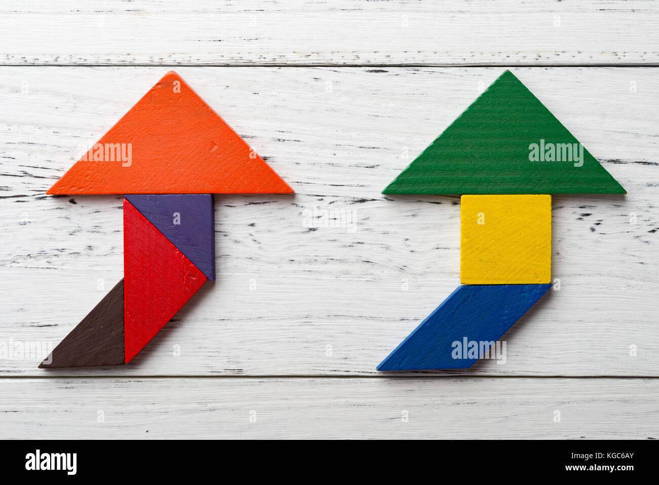 wooden tangram in two going up arrow shapes Stock Photo - Alamy