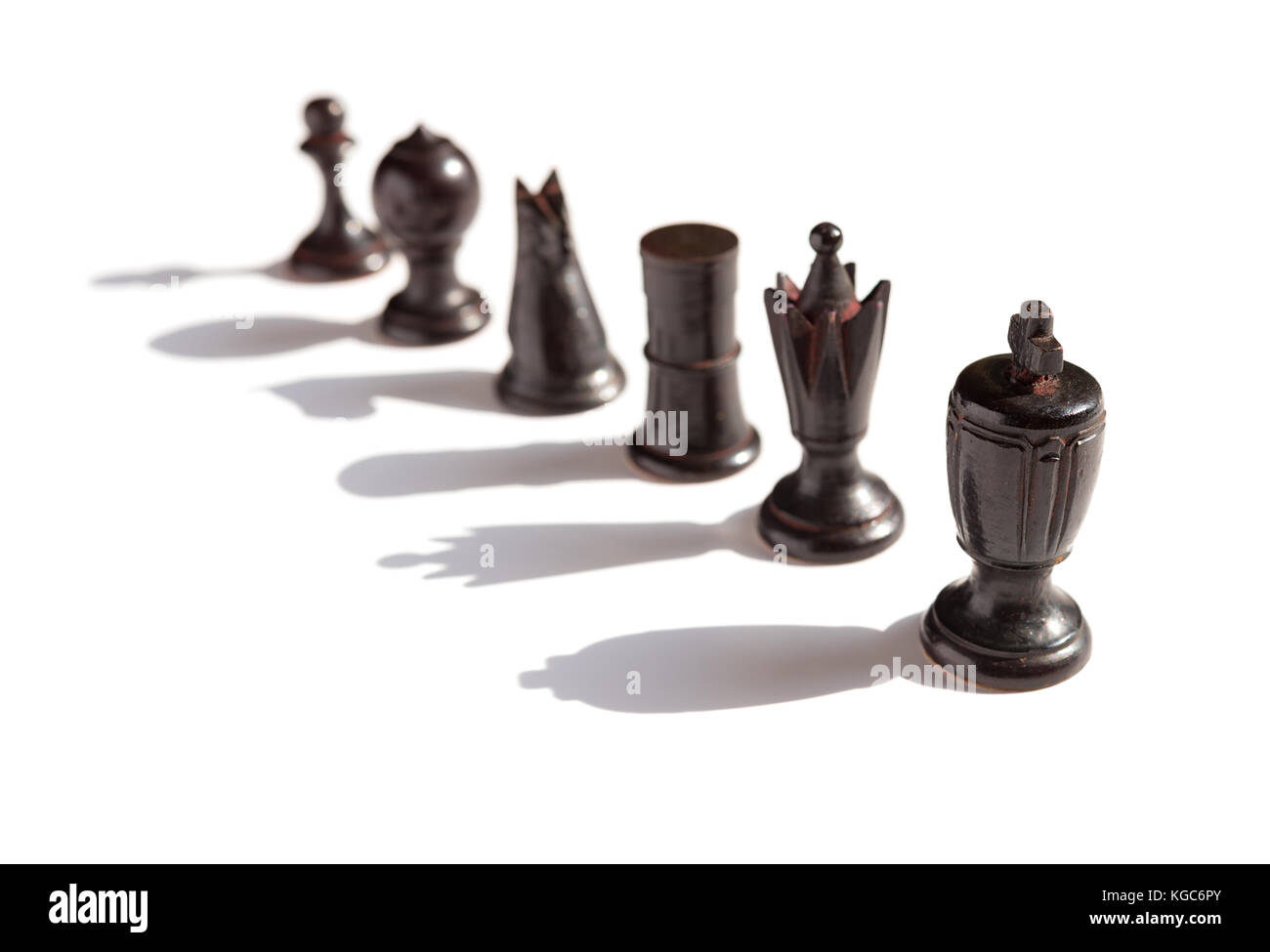 black chesses line up on a white background with shadows Stock Photo ...