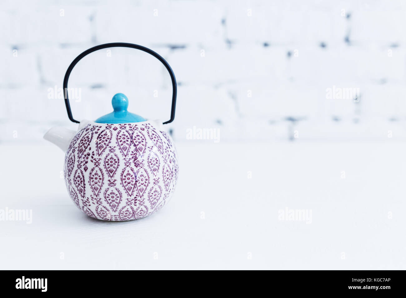 Elegant Chinese style tea pot with a beautiful pattern on white ...