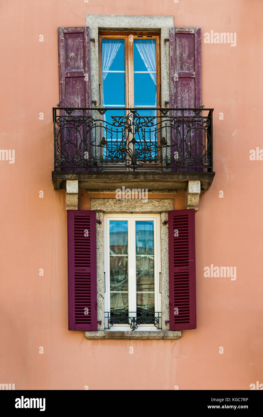 Facade exterior of classic French apartment building's iron railing ...