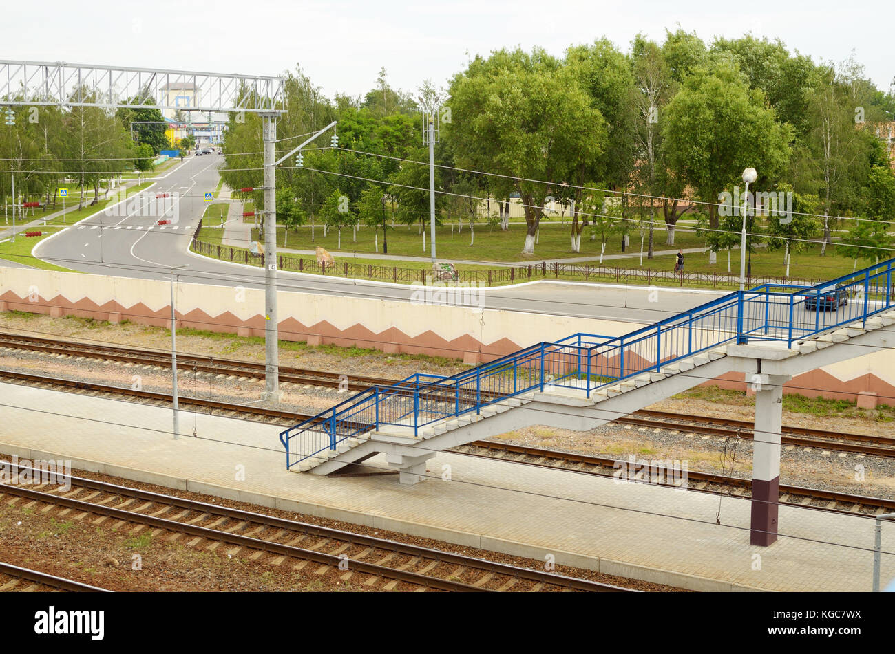 The stairs cross railway tracks that would not fall under the train ...