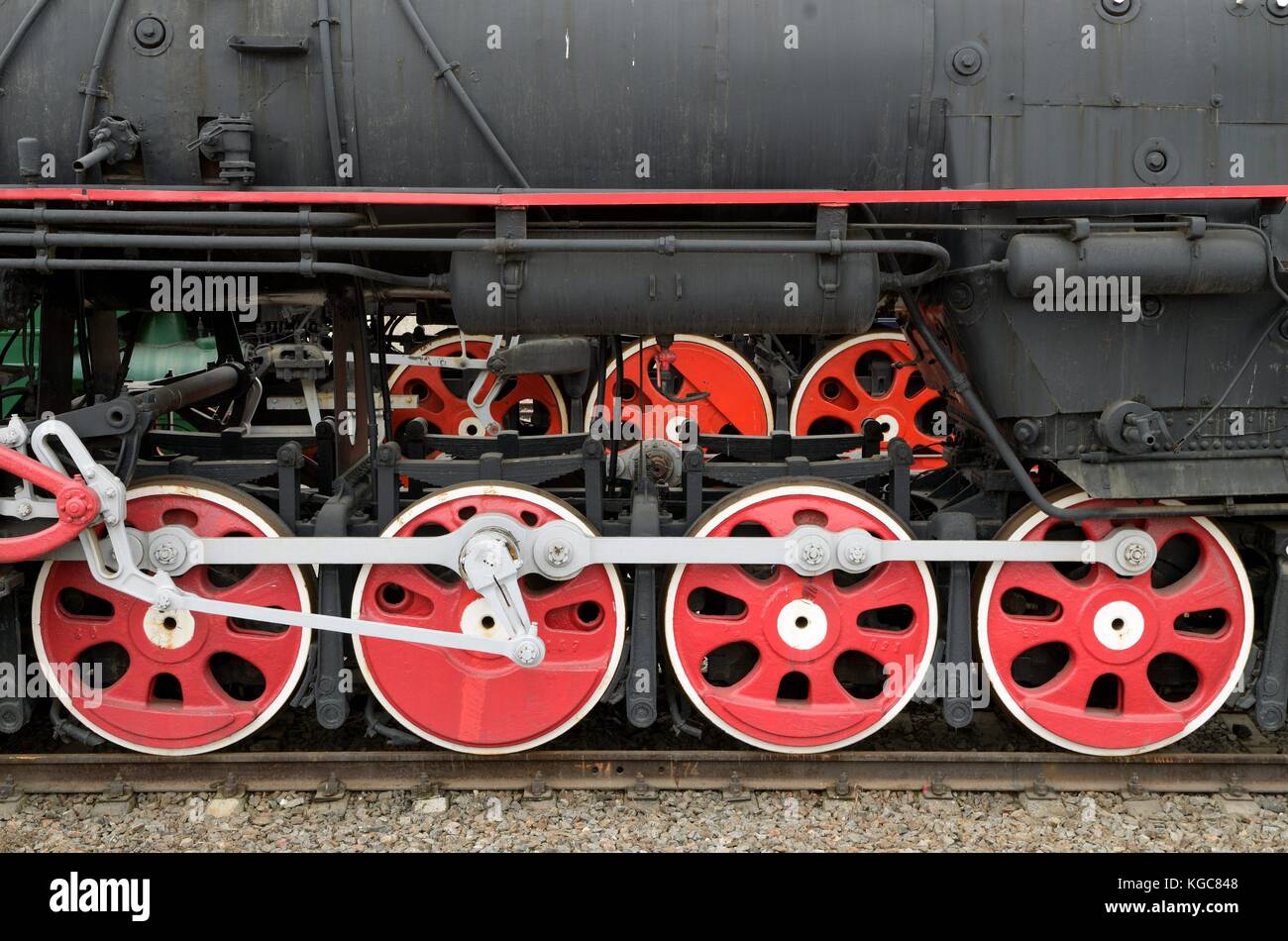 On the photos shown wheels of locomotive,painted red Stock Photo - Alamy
