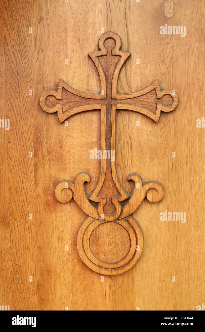 On the entrance wooden doors to the Church master made a cross Stock ...
