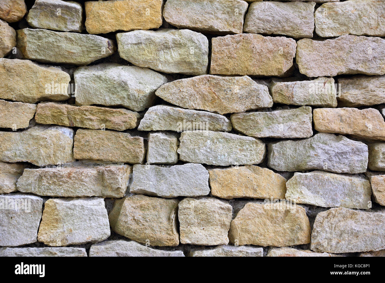 wall made of large stones of different sizes Stock Photo - Alamy