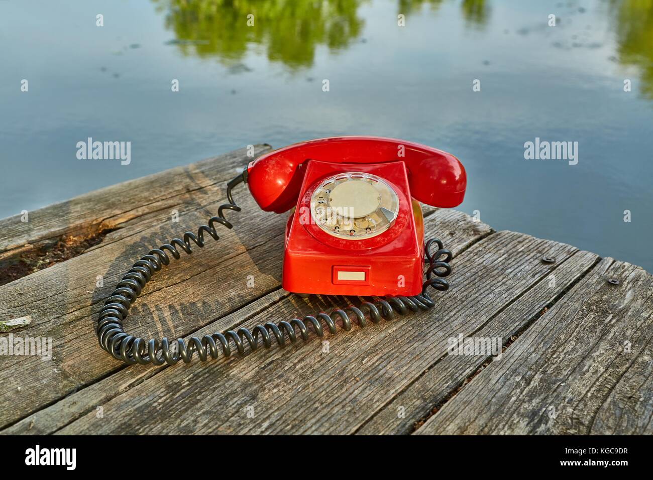 Old telephone in nature Stock Photo - Alamy