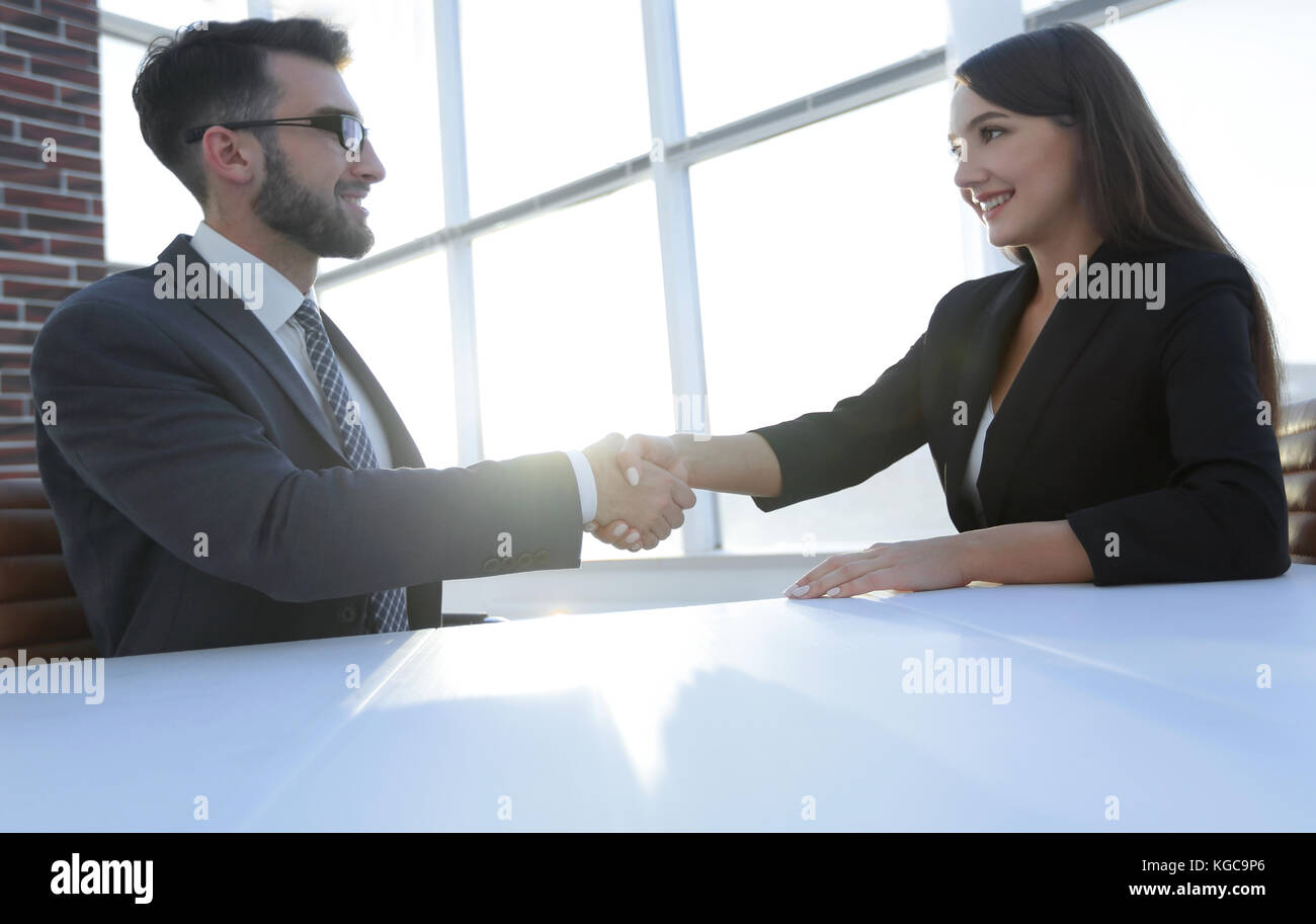 Friendly smiling business people handshaking after pleasant tal Stock ...