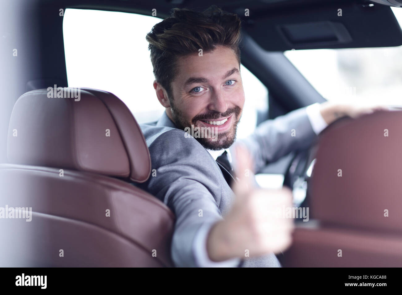 Portrait of a man driving his car Stock Photo - Alamy