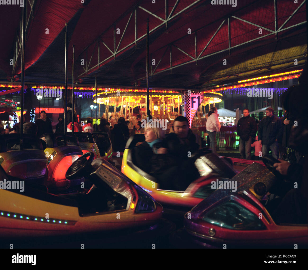 Members of the public enjoy a ride on the dodgems at the Leicester ...
