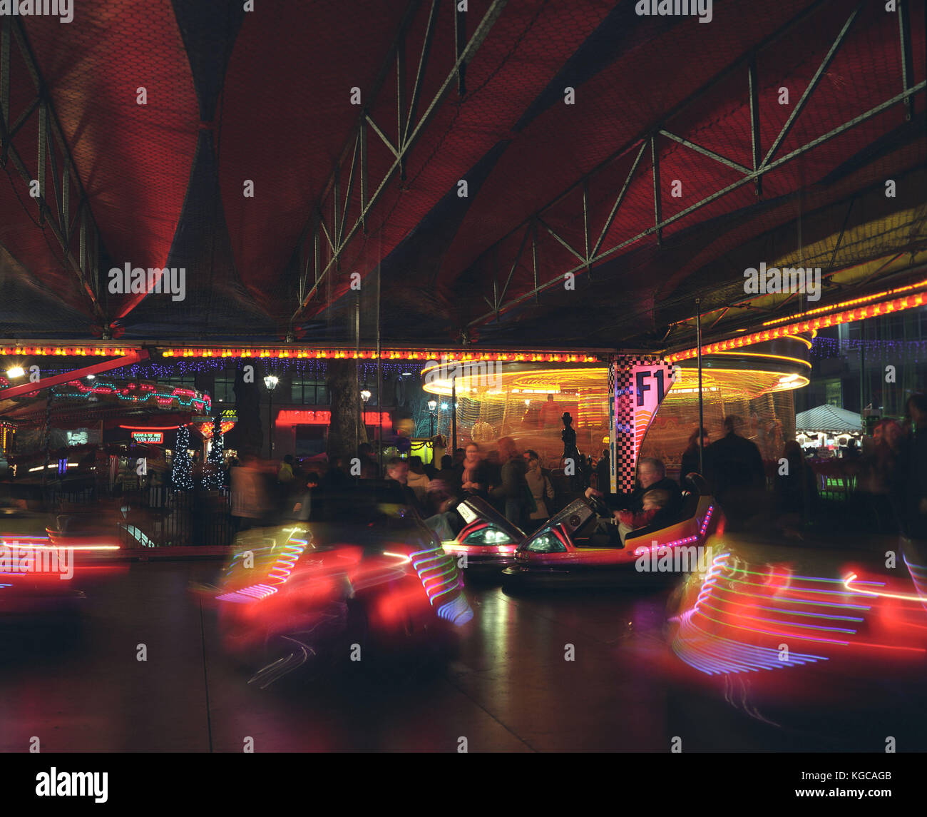 Members of the public enjoy a ride on the dodgems at the Leicester ...