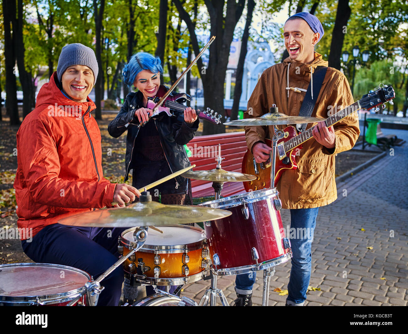 Festival music band. Friends playing on percussion instruments in city ...