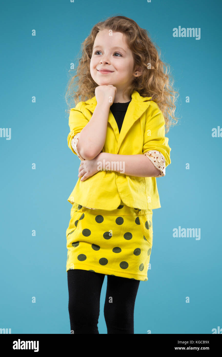 Cute young girl dressed all in yellow Stock Photo - Alamy