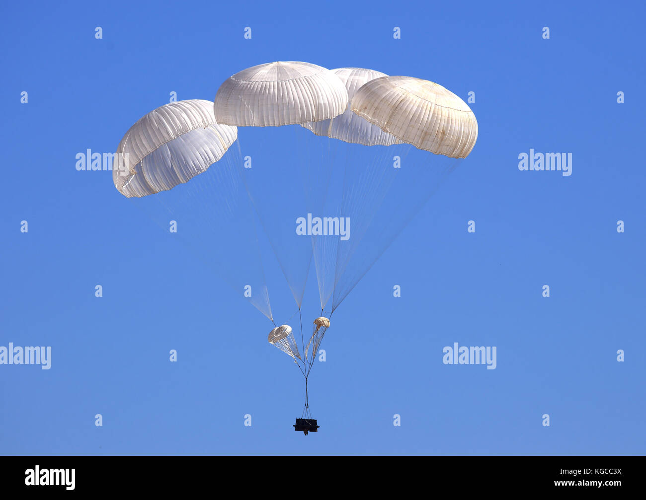 Dropping cargo using military parachute system Stock Photo - Alamy