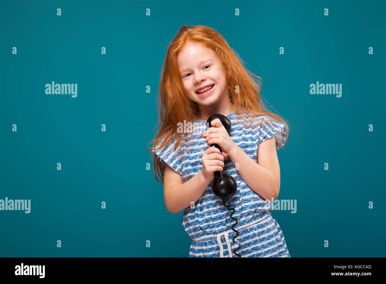 Cute beauty little girl in tee shirt with long hair talk a phone Stock ...